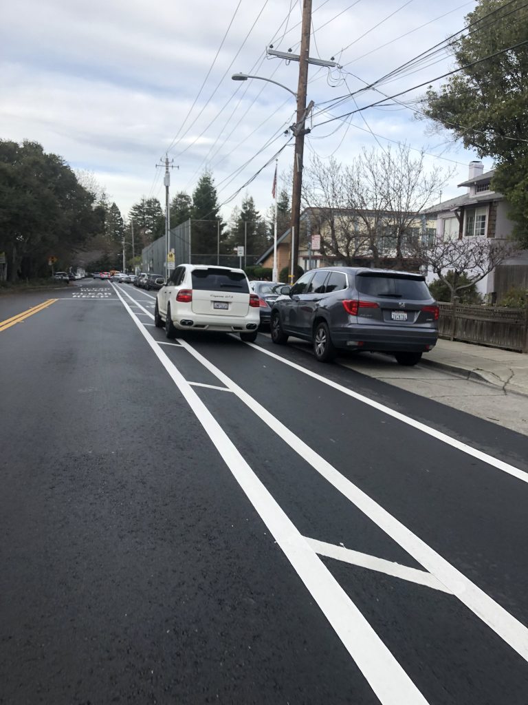 Cars parked in the bike lane. It's dangerous, but surprisingly not ...